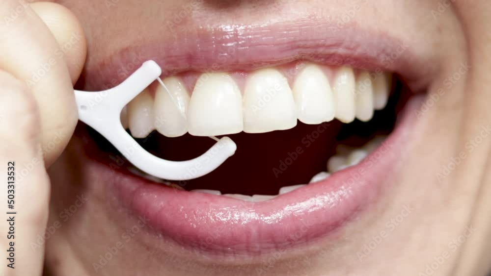 close up4 k video woman mouth smiling and flossing her teeth with white ...