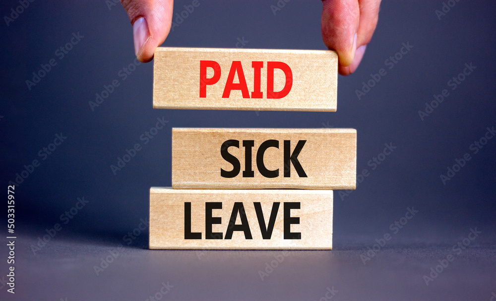 Paid sick leave symbol. Concept words Paid sick leave on wooden blocks ...