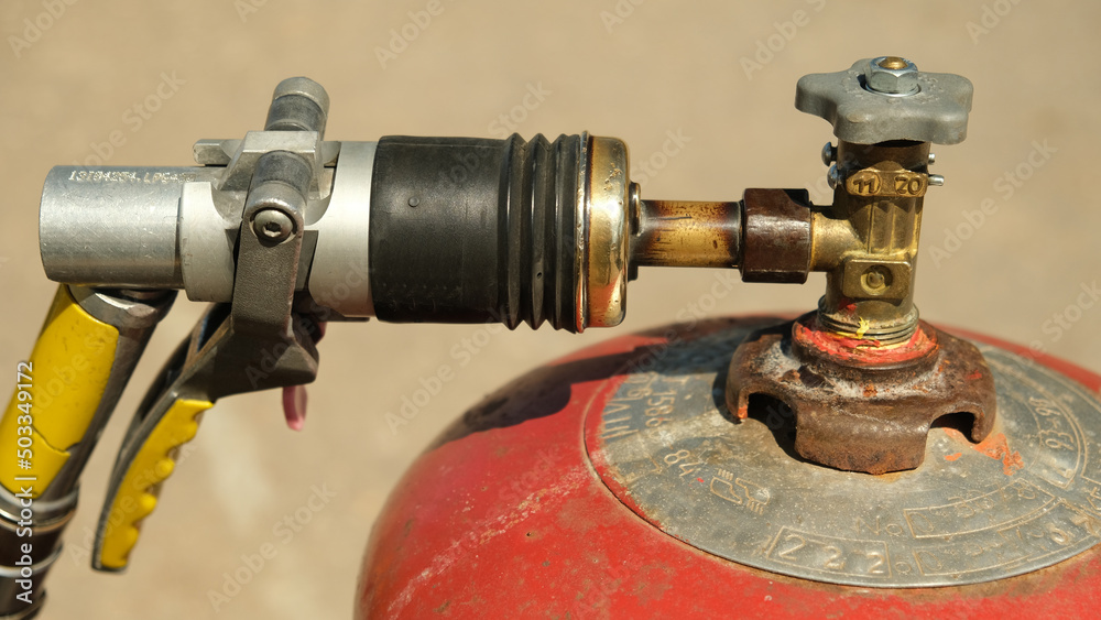 Filling the gas cylinder with gas. Gas cylinder for cooking. Stock ...