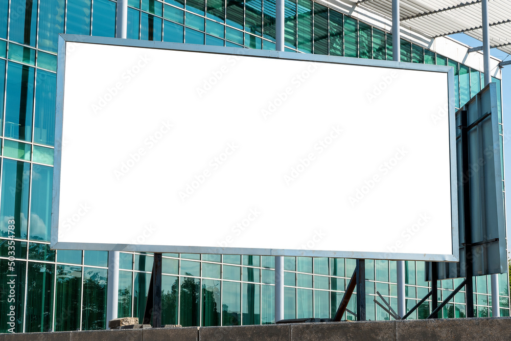 Fotka „Advertising billboard mock-up in front of modern office building ...