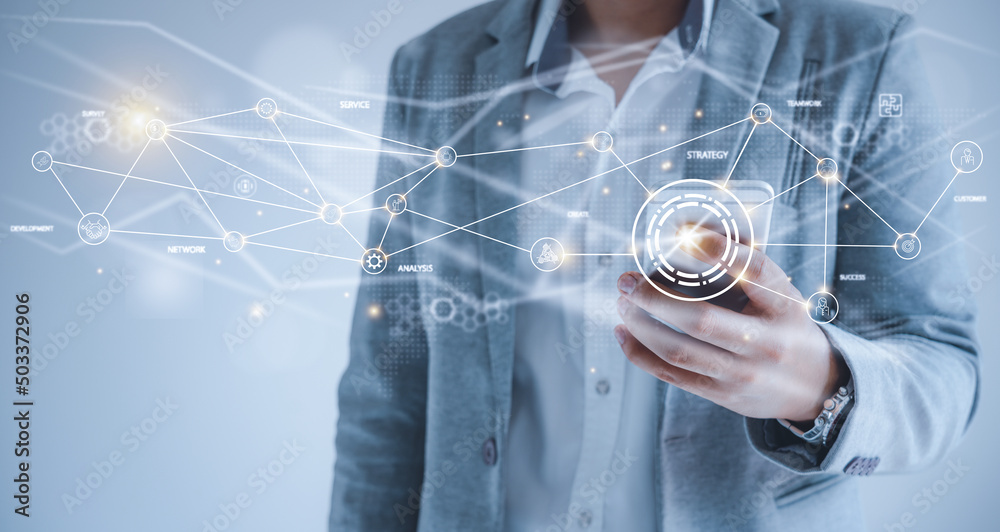 Human using mobile phone technology to analyze growing statistics ...