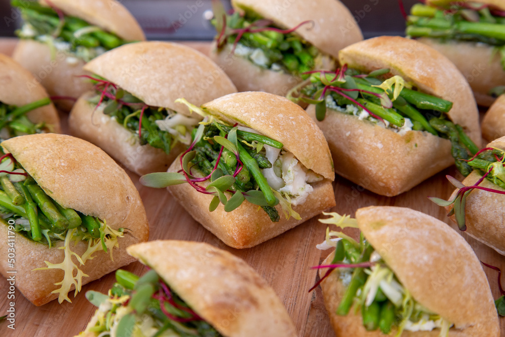 mini food cocktail canapé bread with chicken in low light with grain ...