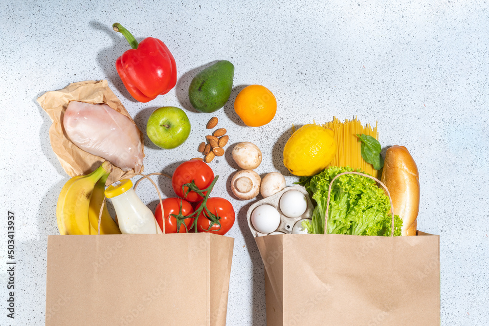 Fresh vegetables, meat, bread fruits in paper grocery bag. Delivery ...
