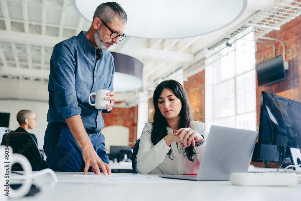 Working together on a project Stock Photo | Adobe Stock