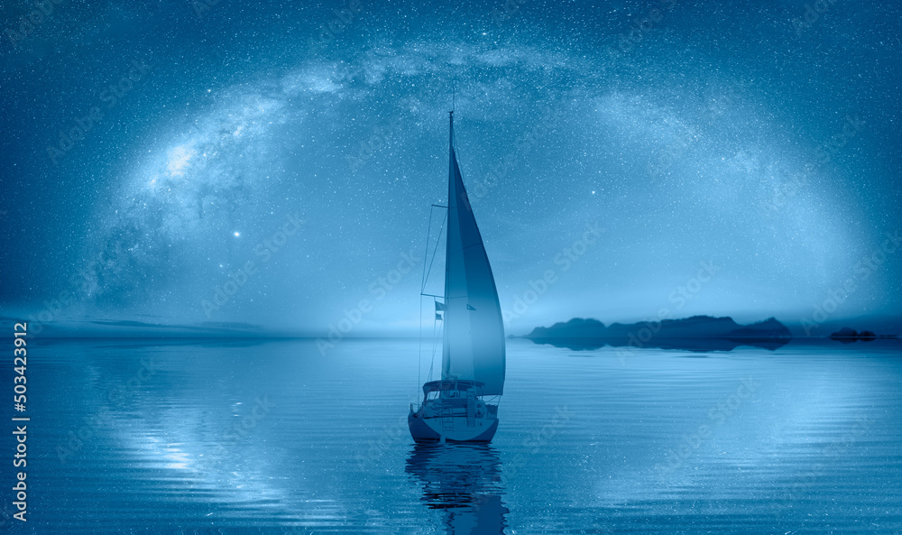 Lone sailing luxur yacht under starry night sky with Milky Way galaxy ...