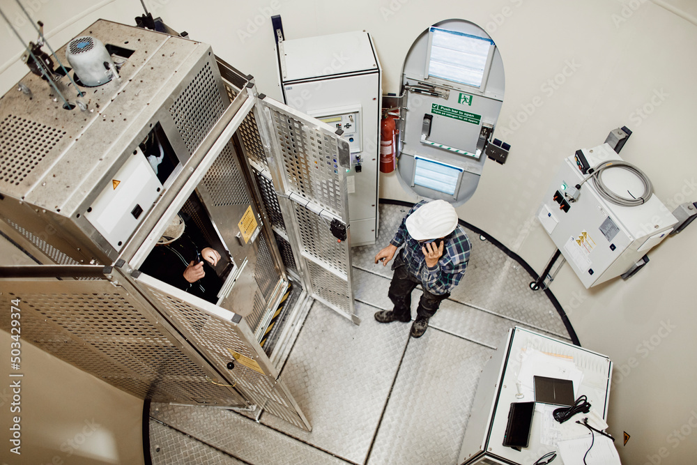 Engineer working in wind turbine Stock Photo | Adobe Stock
