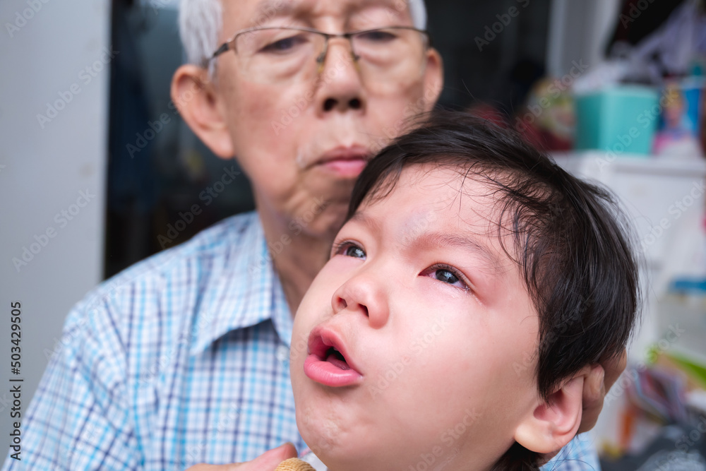 Portrait 1-2 year old Asian boy is coughing, child cries with red and ...