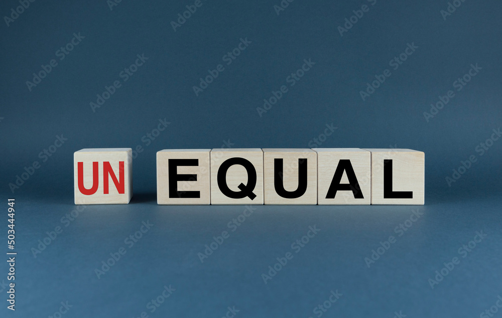 Cubes form the words Equal or Unequal. Equal or Unequal concept Stock ...