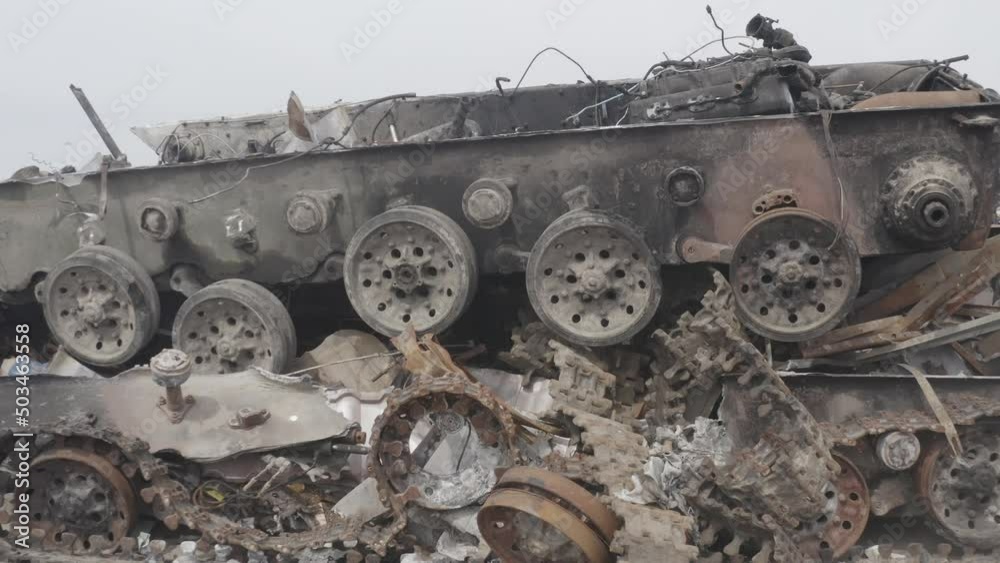 Destroyed military convoy. Burnt combat vehicles. Rusty tech ...