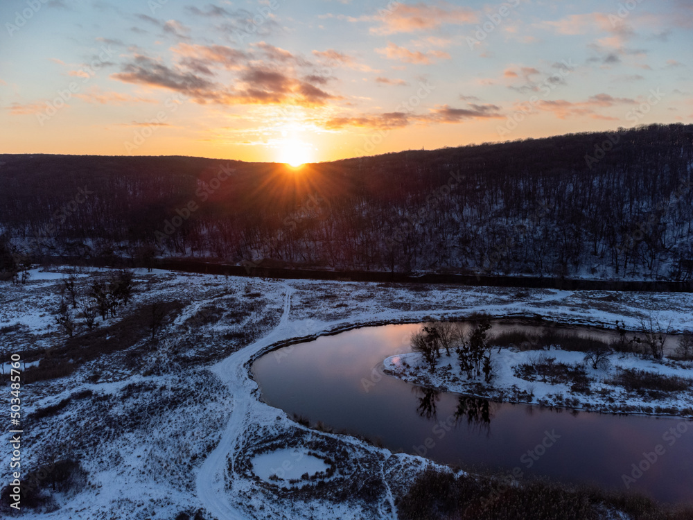 Winter aerial view on river curve with scenic reflection. Zmiyevsky ...