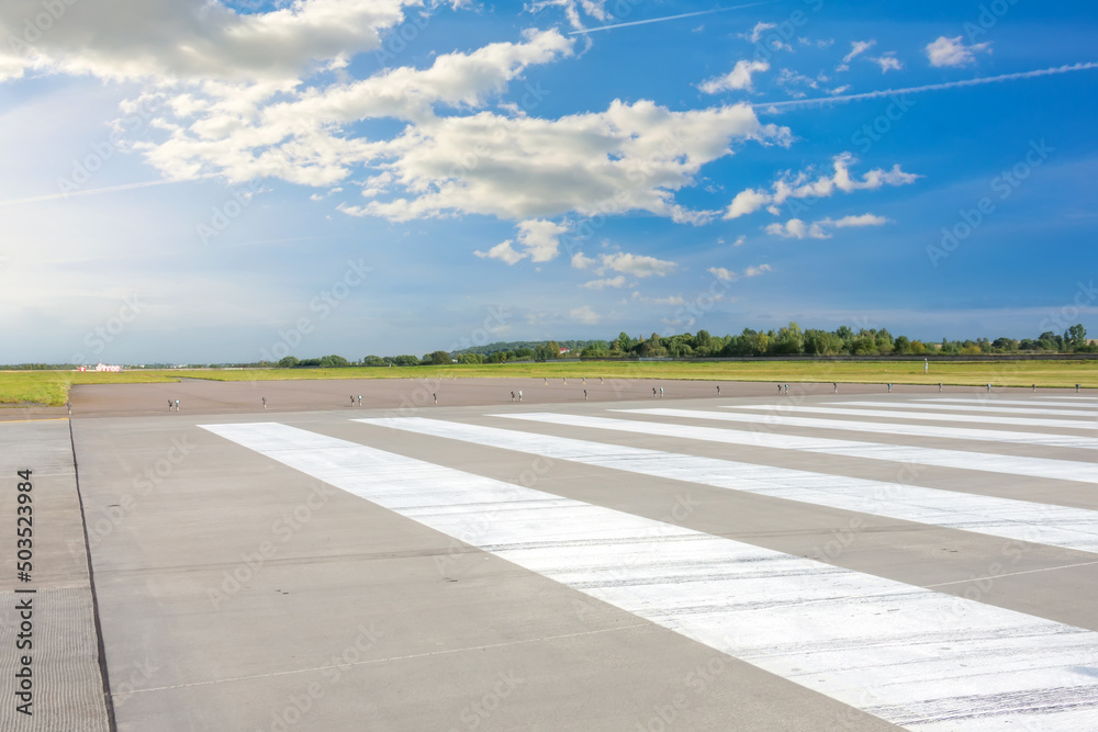 Empty Runway, airstrip in the airport with marking on blue sky with ...
