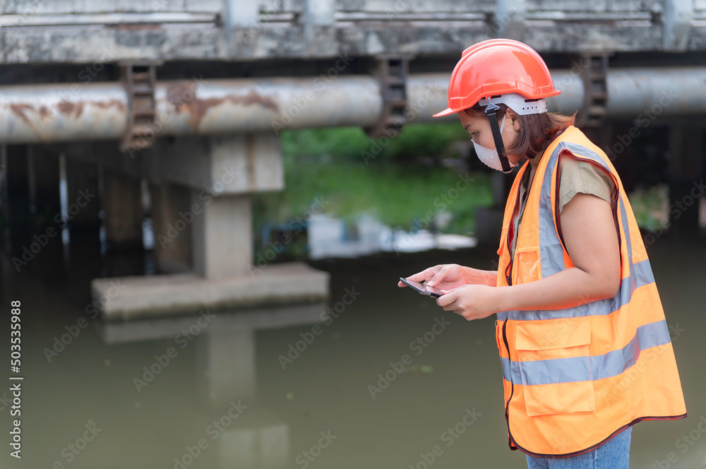 Asian Female engineering working . at sewage treatment plant,Marine ...