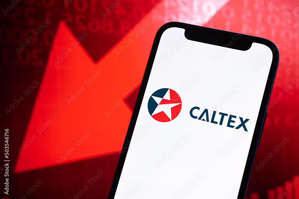 Caltex oil prices, logo close-up. Collapse, petroleum crisis, red arrow ...