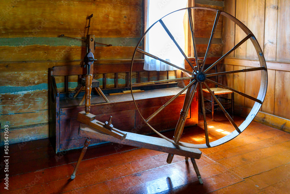 Antique spinning wheel. Seen in Black Creek Pioneer Village which is an ...
