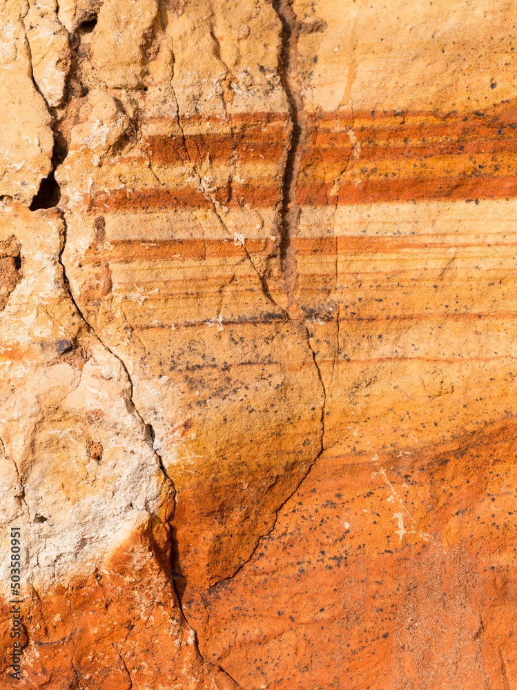 Sedimentary rocks with a high content of iron oxide. Red soil, loam ...