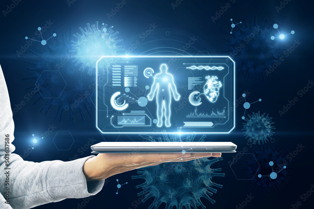 hand holding tablet with abstract glowing medical cardiology interface on blurry background with ...