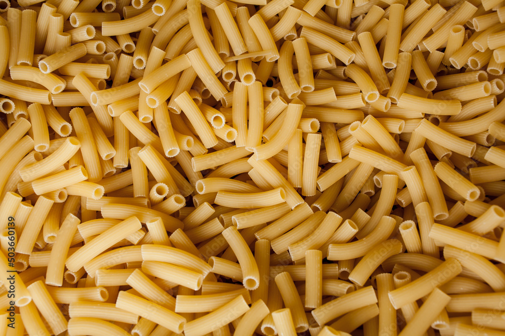 uncooked pasta tubules. Raw pasta background. uncooked pasta tubules ...