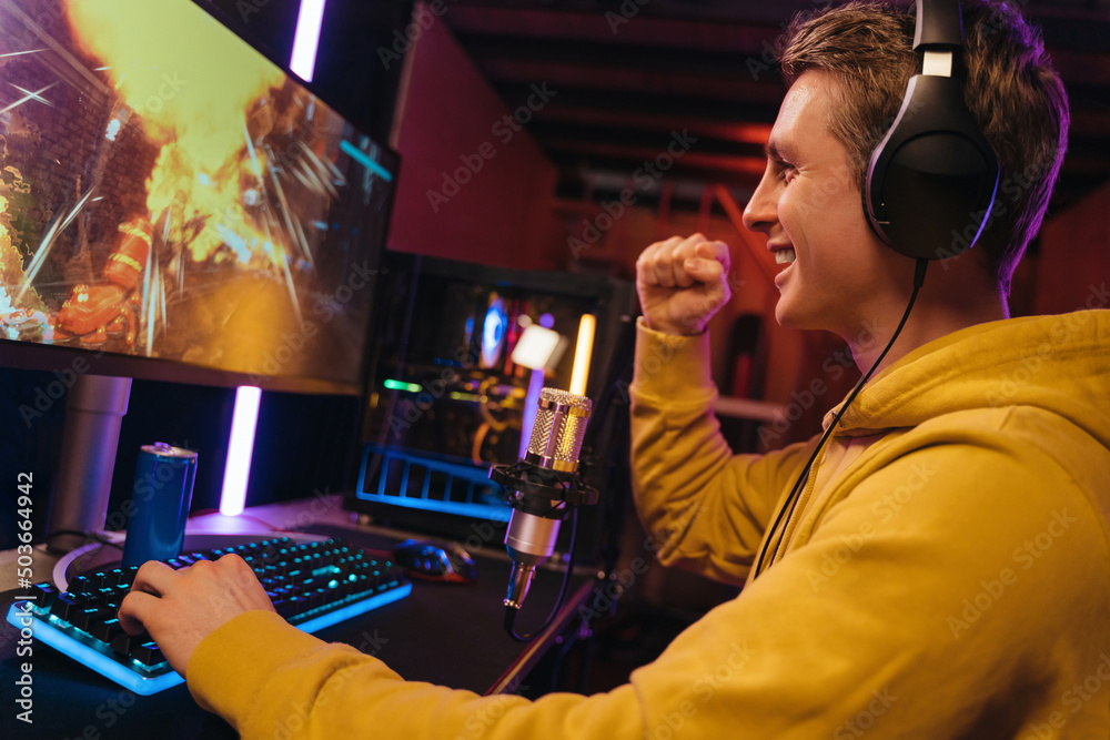 Professional eSports gamer plays shooter video game on his powerful ...