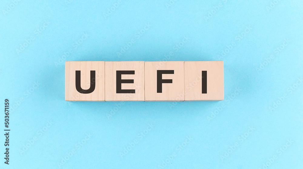 Wooden cube block with text UEFI Unified Extensible Firmware Interface ...