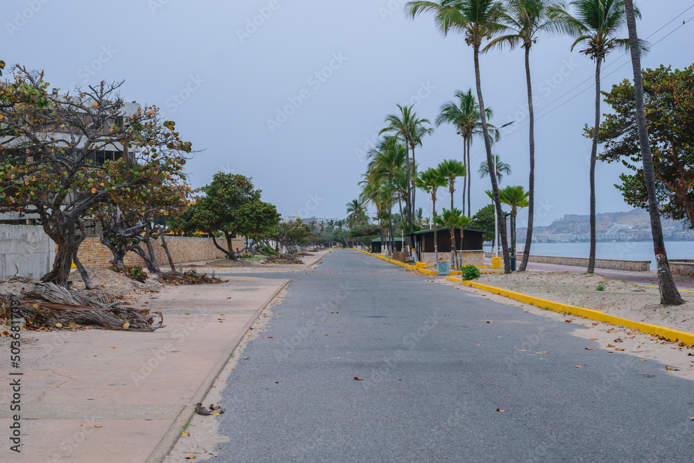 Photos of a beach on a cloudy day from different angles and places, the ...