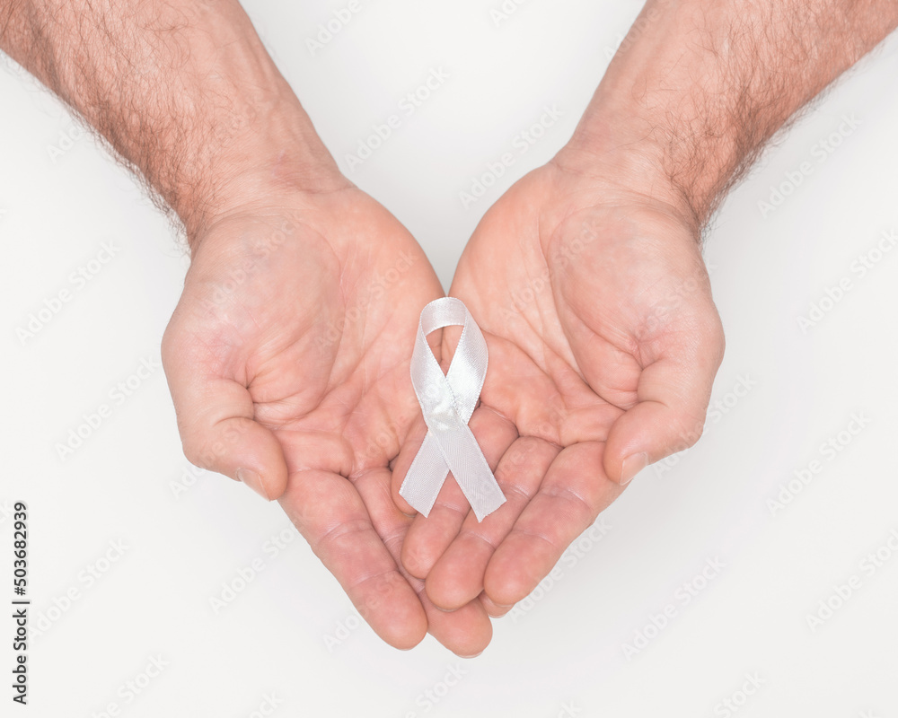 White awareness ribbon. Lung cancer awareness white ribbon bow on man ...