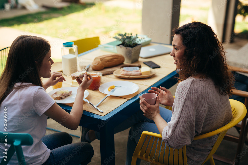 family having breakfast outdoor in back yard Stock Photo | Adobe Stock