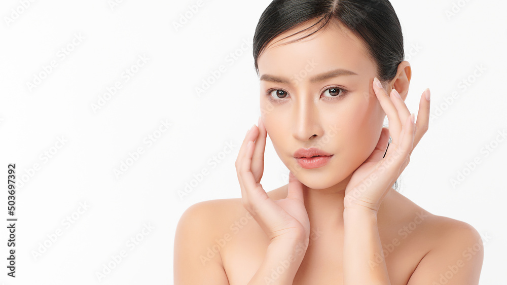 Beautiful young asian woman with clean fresh skin on white background ...