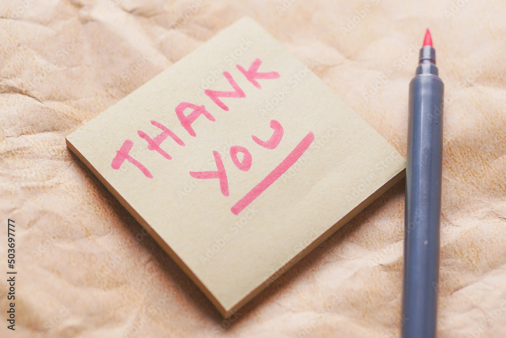 thank you message on a sticky note on old paper Stock Photo | Adobe Stock