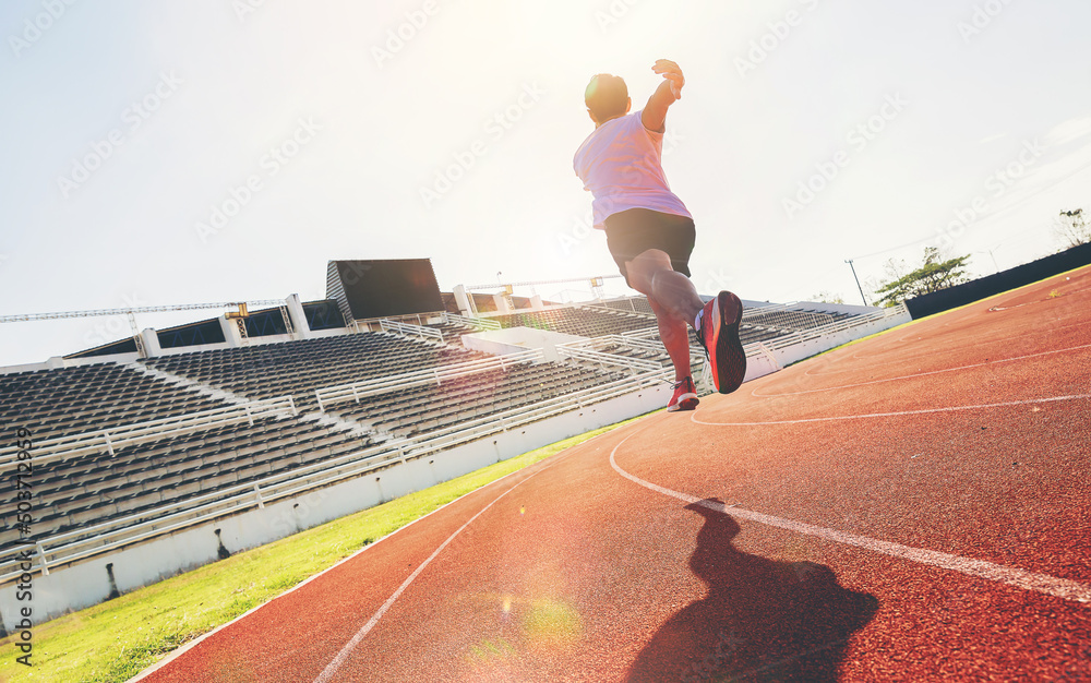 Fit young man running sprinting at the racetrack. Fit runner fitness ...