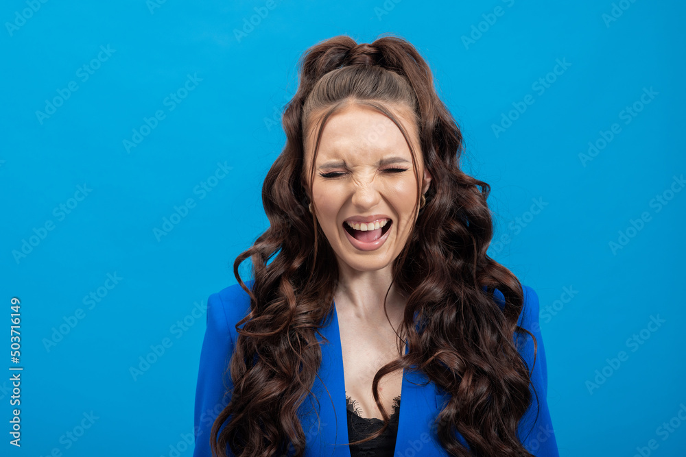 Screaming, hate, rage. Crying emotional angry woman screaming on blue ...