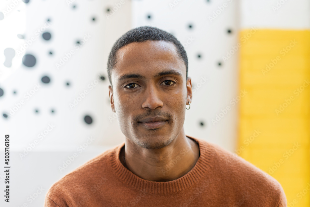 Young Moroccan man with magnetic gaze looking at the camera - Studio ...