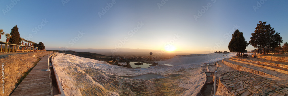 Fisheye view of the landscapes of Pamukkale, Turkey, and a tiny hot-air ...