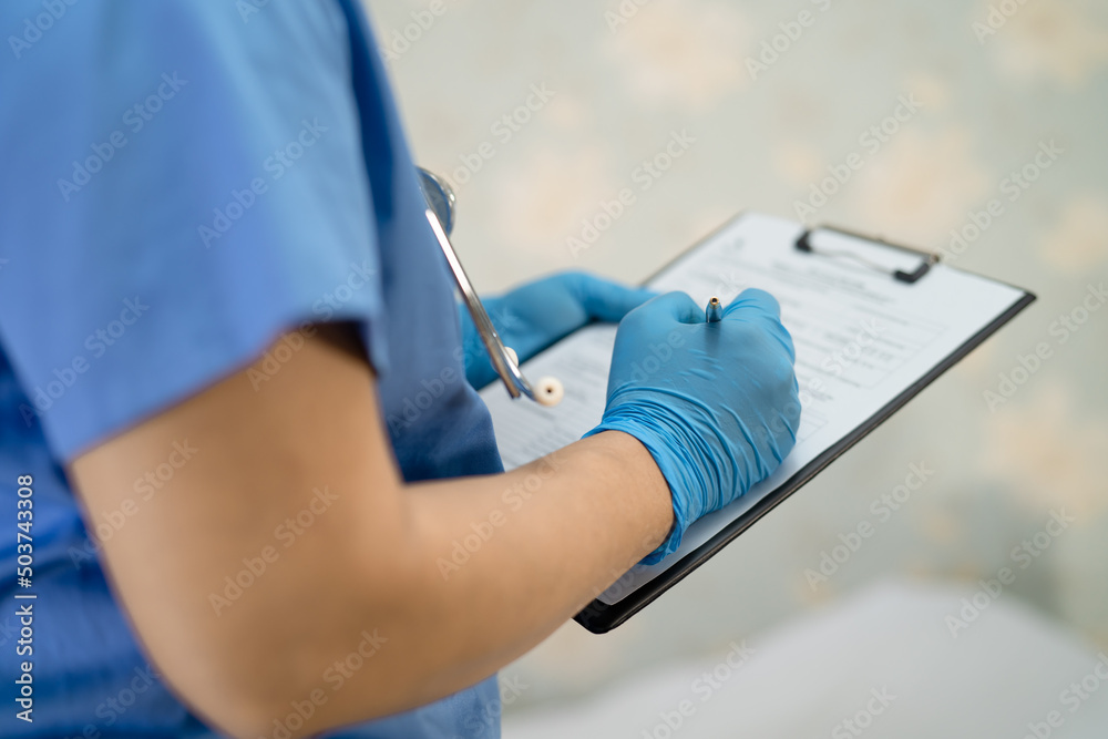 Asian doctor wearing face shield and PPE suit new normal to check ...