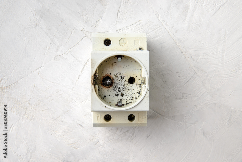 The electrical outlet burned out due to a short circuit in the ...