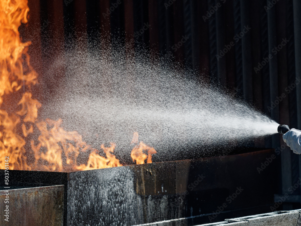put out a fire during a drill with a powder extinguisher Stock Photo ...