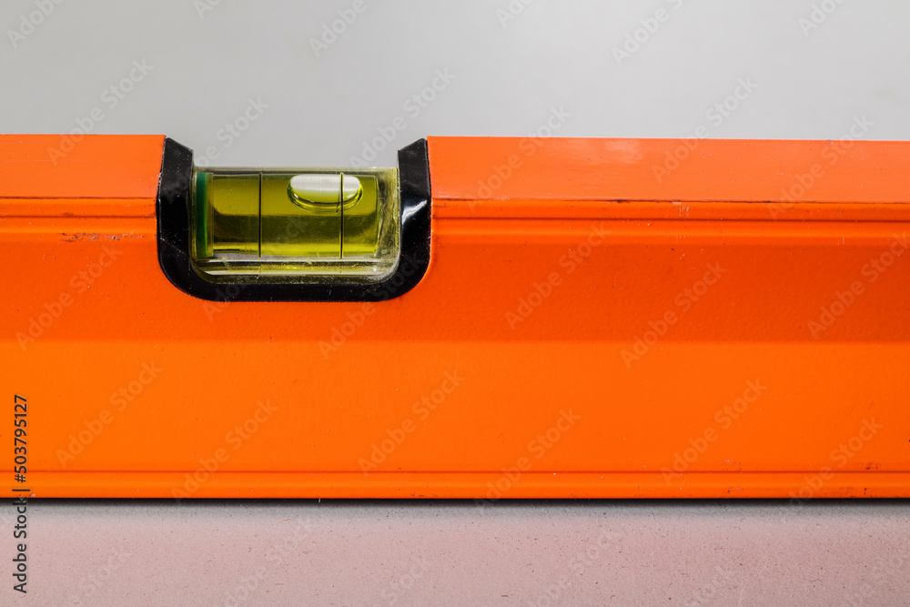 Level on a sloping surface. Bubble level indicates the slope of the ...