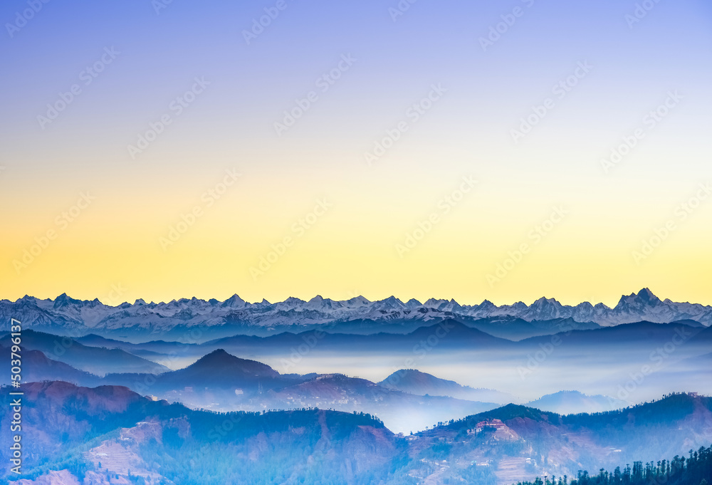 Sunrise over Himalaya mountains with mist and clouds. Himalayan range ...