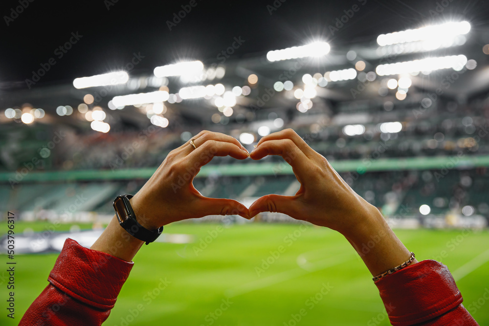 She loves this team. Heart shape for the favorite football club during ...