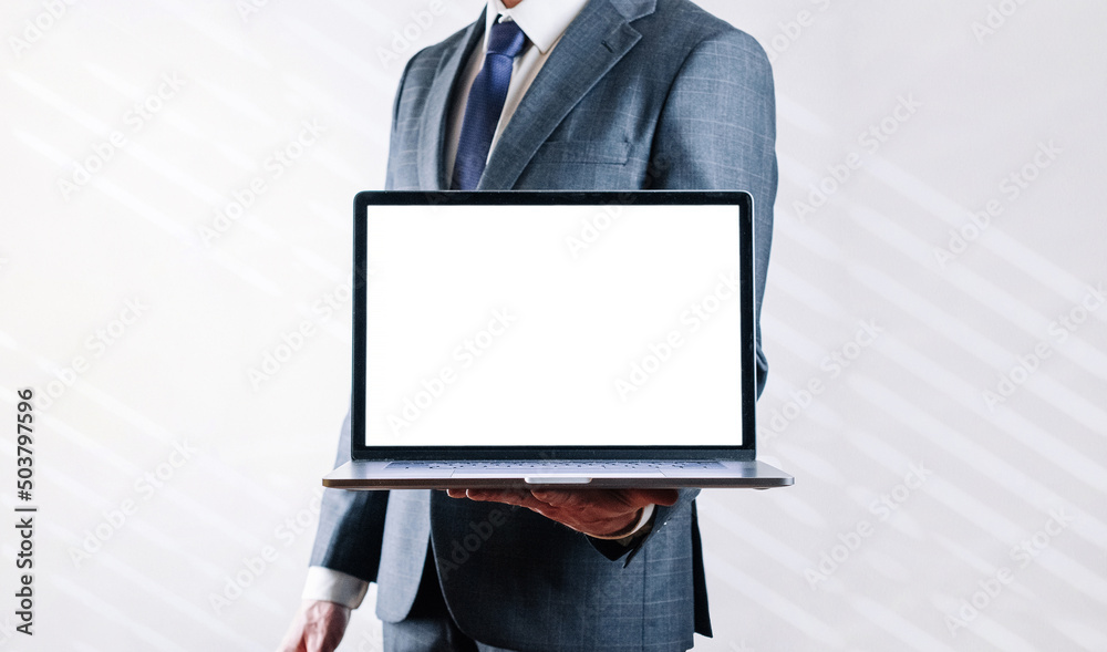 Foto de Man laptop screen mockup. Businessman holding notebook. Empty ...