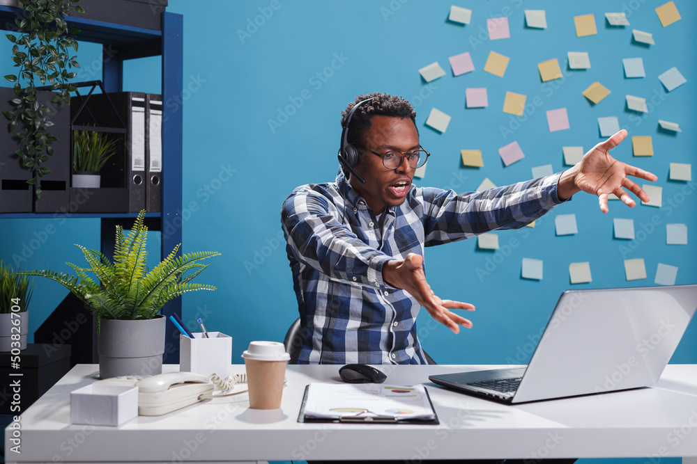 Mad angry call center operator shouting with rage while talking with ...