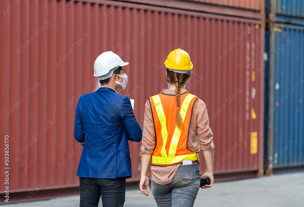 Supervisor and worker in the container yard, Industrial engineer and ...
