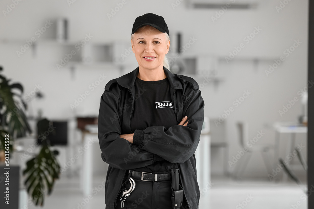 Female security guard in office Stock Photo | Adobe Stock