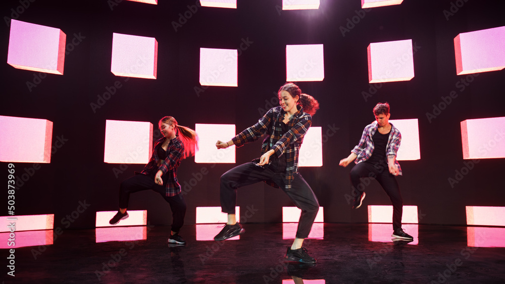 Diverse Group of Three Professional Dancers Performing a Hip Hop Dance ...
