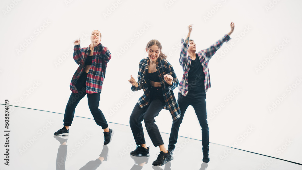 Diverse Group of Three Professional Dancers Performing a Hip Hop Dance ...