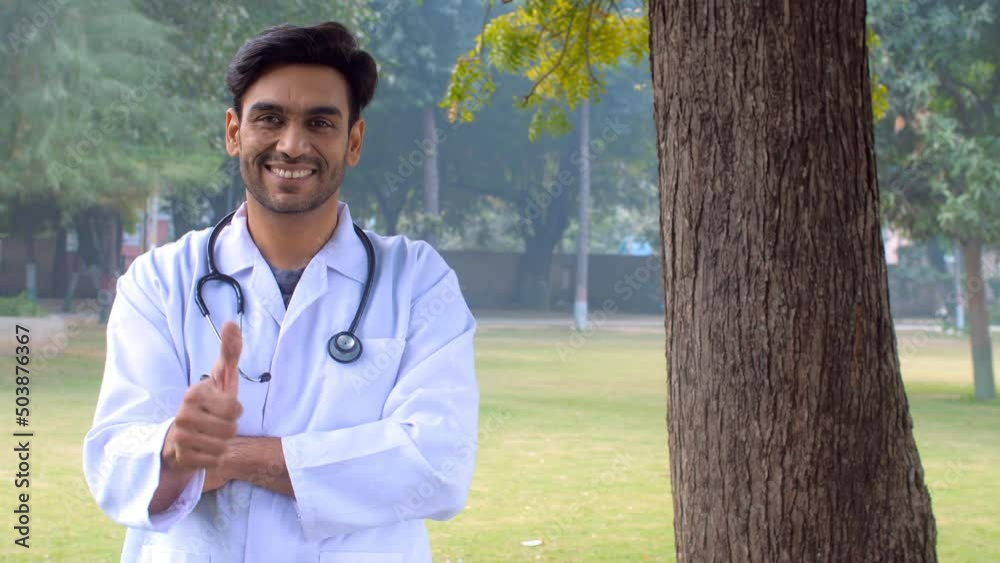 A young aspiring male doctor posing for the camera - stethoscope doctor ...