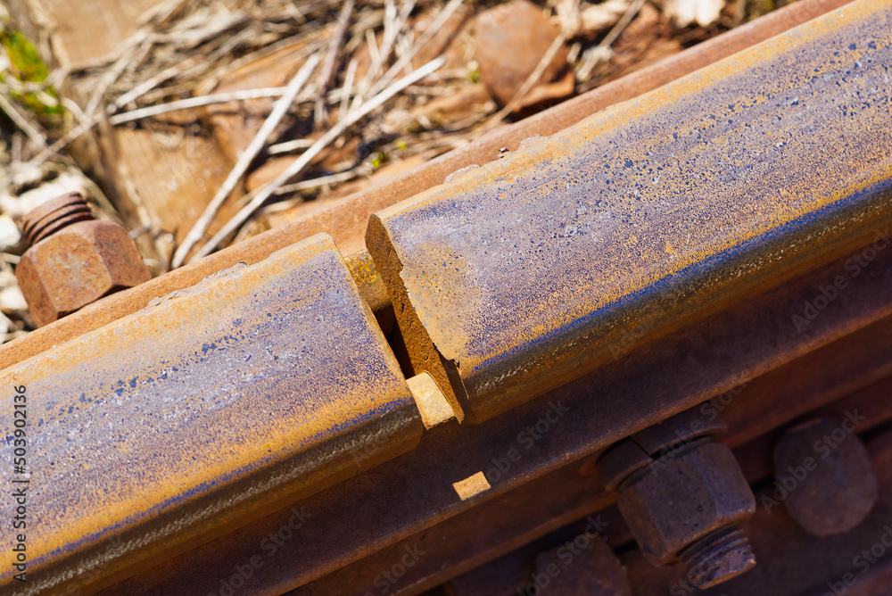 Broken Connecting two rails. with visible bolts. Train tracks underlay ...
