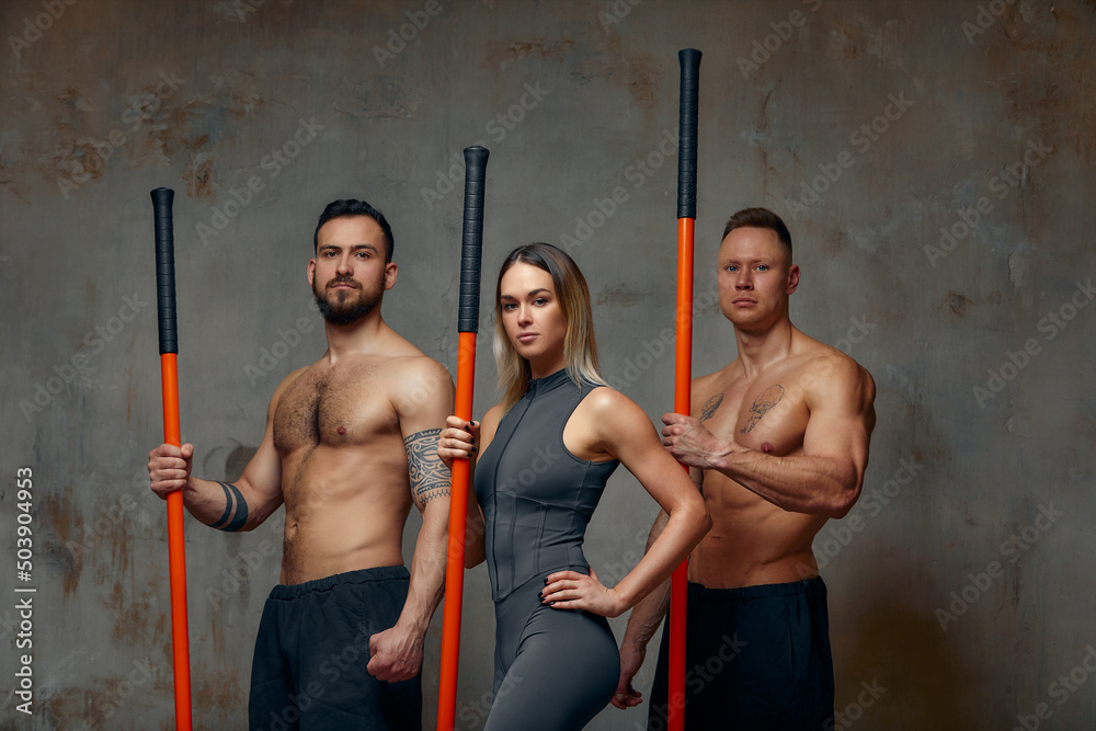 People stand together and practice sticks. Karate masters posing with ...