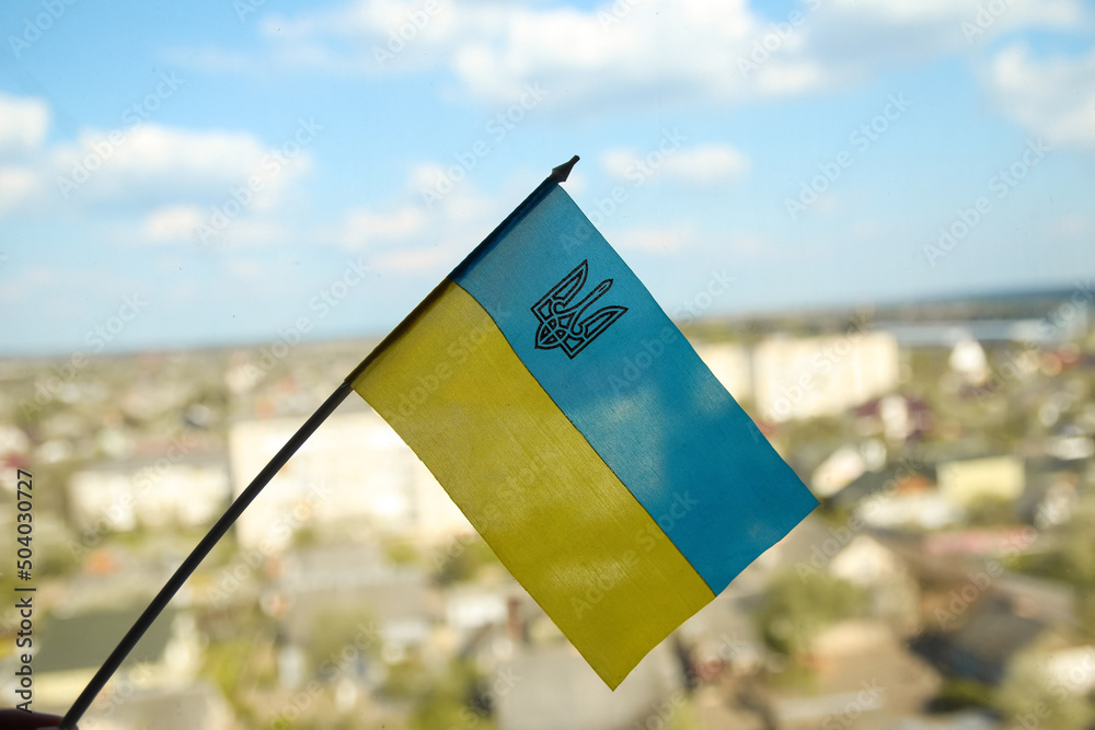 Defocus Ukraine flag. Large national symbol fluttering in blue sky ...