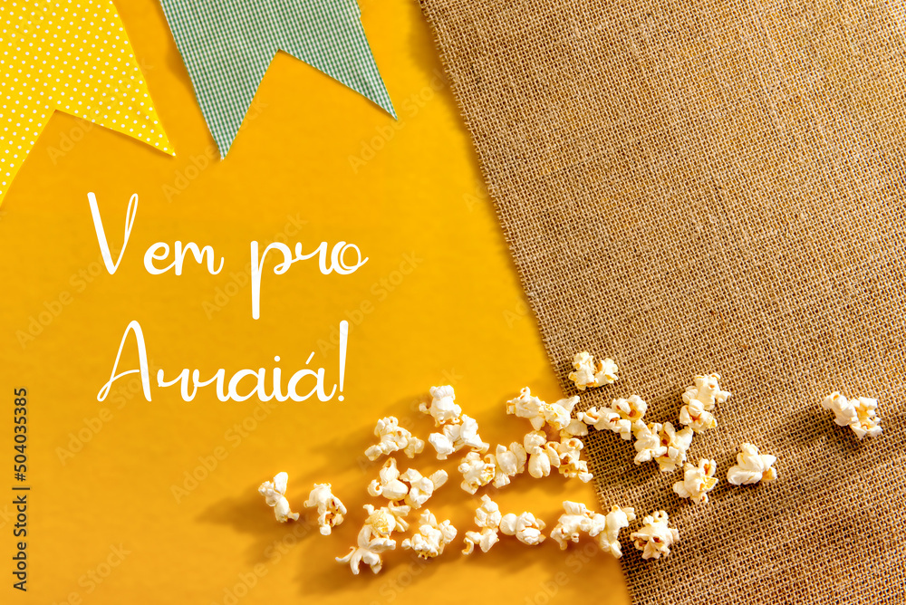 Brazilian june party background. Top view. Written in Portuguese (come ...