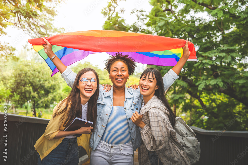Lesbian three hugging in the park, freedom in love concept, LGBT ...